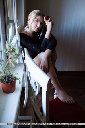 amateur photo Erotic young Daniel Sea strips at her desk to spread her long legs wide open