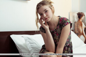 amateur photo Gorgeous blonde teen Daniel Sea does an ass grab after baring her big boobs